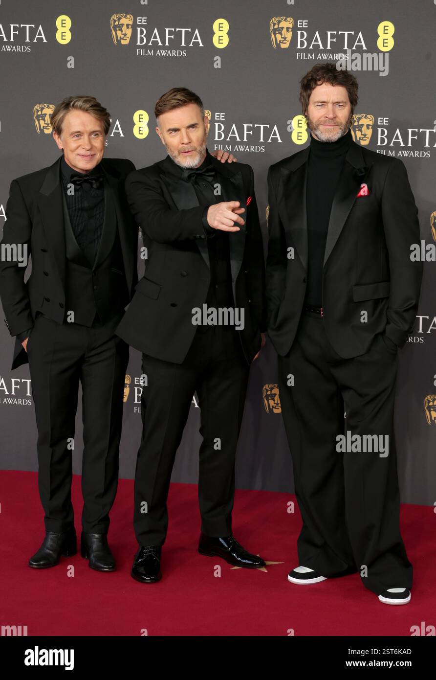 London, UK. 16th Feb, 2025. Mark Owen, Gary Barlow and Howard Donald of ...