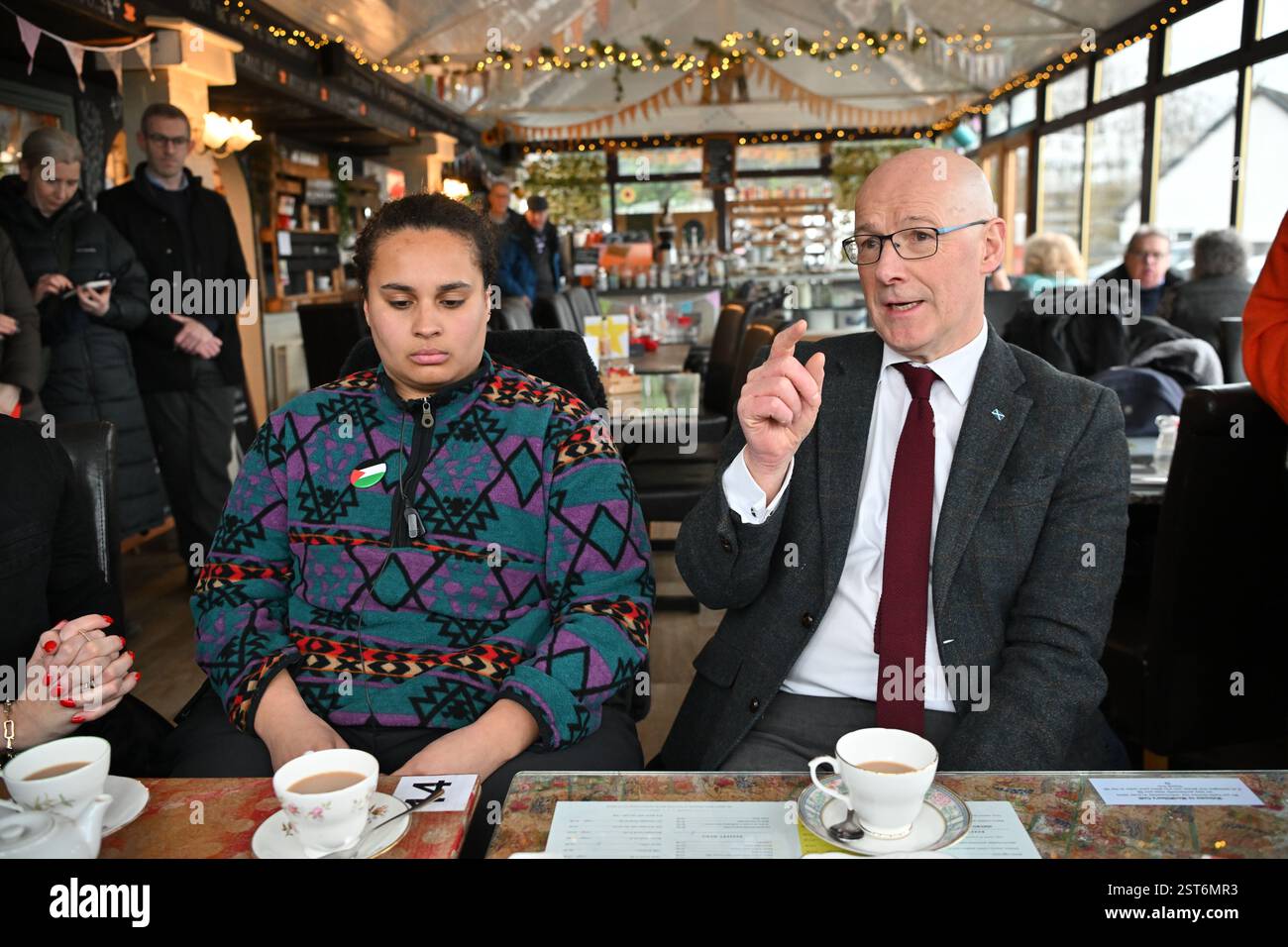 First Minister of Scotland John Swinney speaks with production trainee ...