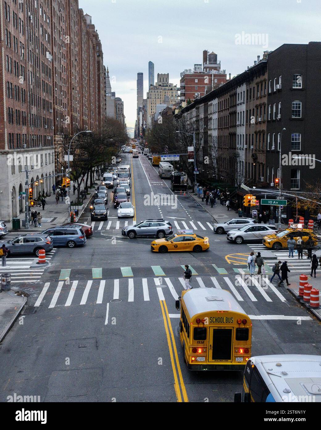 Busy New York City street scene with traffic, yellow taxis, a school ...