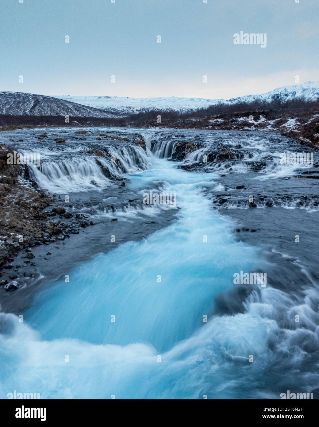 Long exposure shot of Bruarfoss Waterfall in Iceland, featuring its ...
