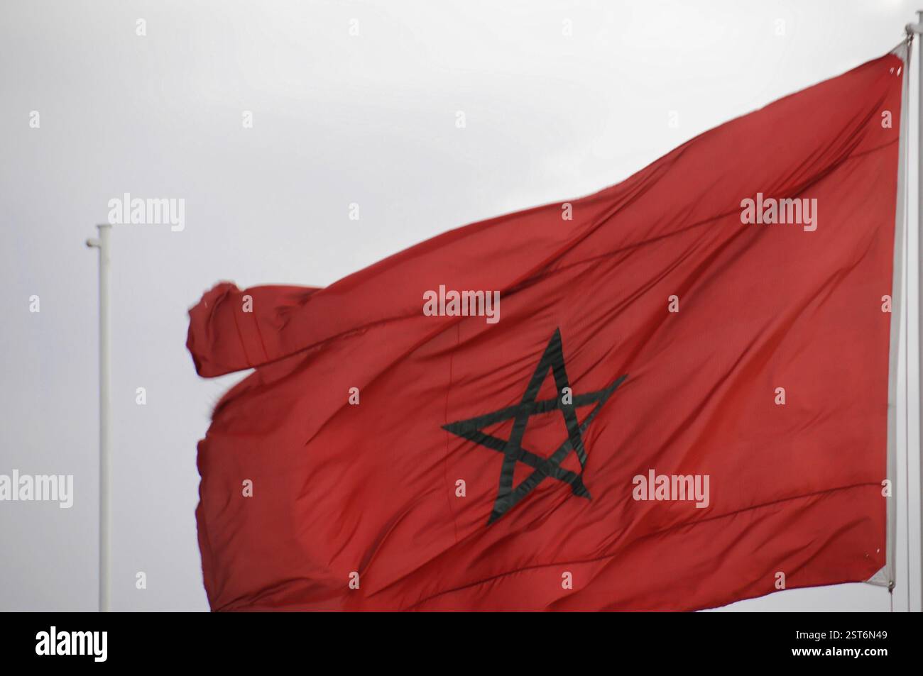 Red Moroccan flag with green star waving in the wind, Marrakech ...