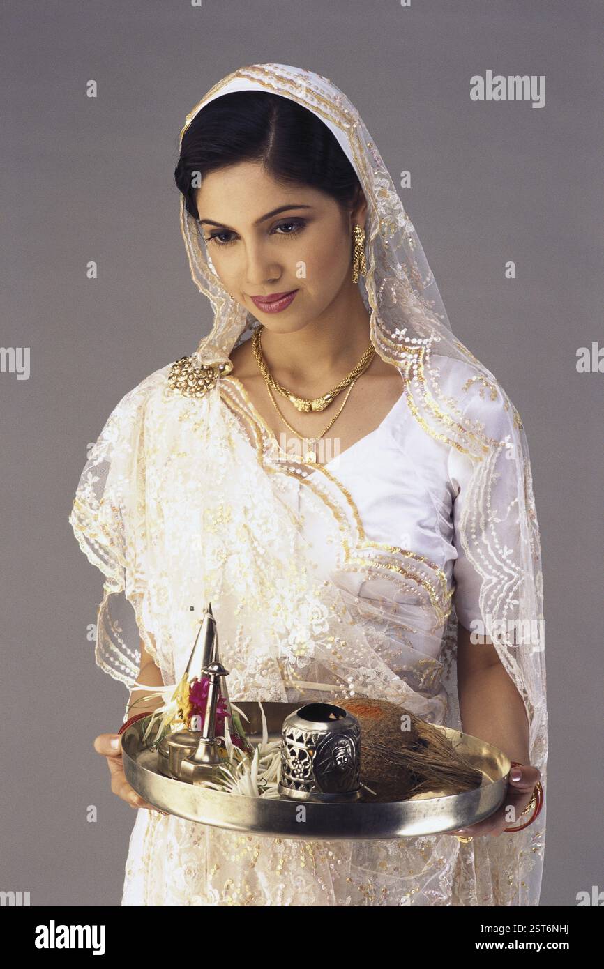 Parsee Bride Dressed In Traditional Bridal Costume, Mid Shot Holding A ...