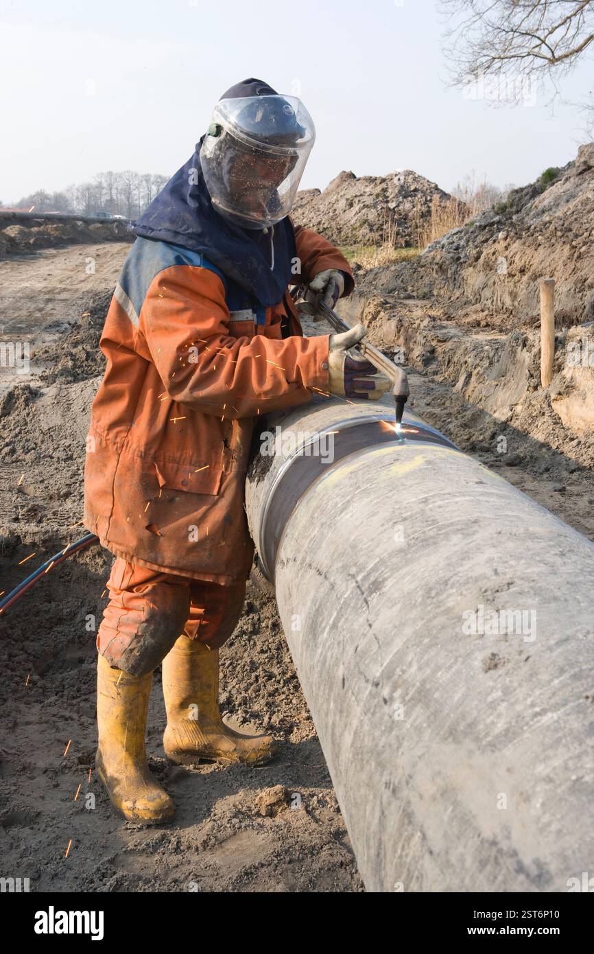 Asbestos removal and disposal of a pipeline. Remediation pipeline. Cutting a pipeline Stock ...