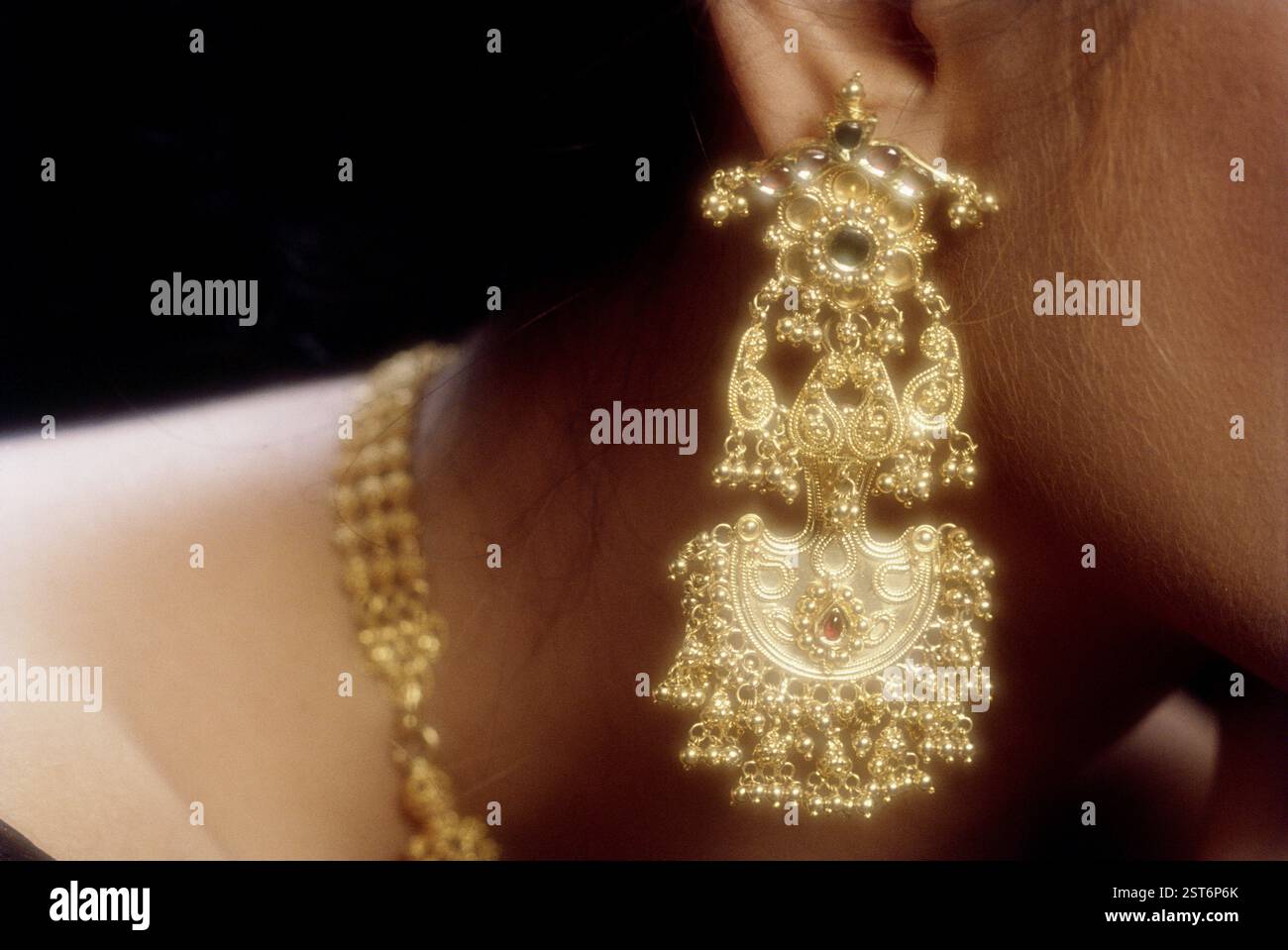 Woman wearing gold jewellery, india Stock Photo - Alamy