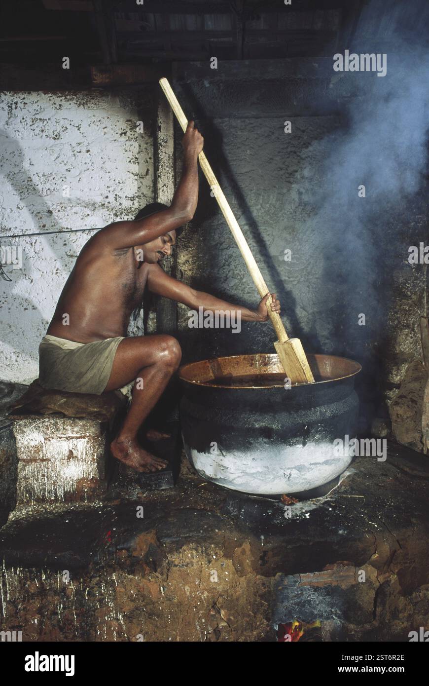 Man making halwa at kozhikode, kerala, india Stock Photo - Alamy