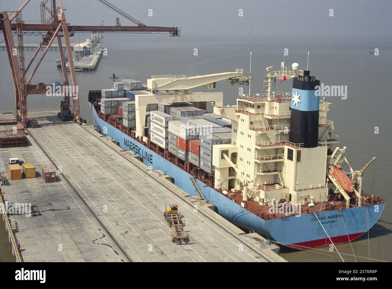 Shipping, containers loading in ship, india Stock Photo - Alamy