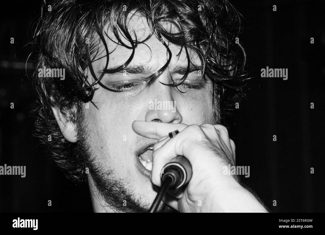 Singer Nick Atkinson from the pop band ROOSTER playing a sweaty early ...