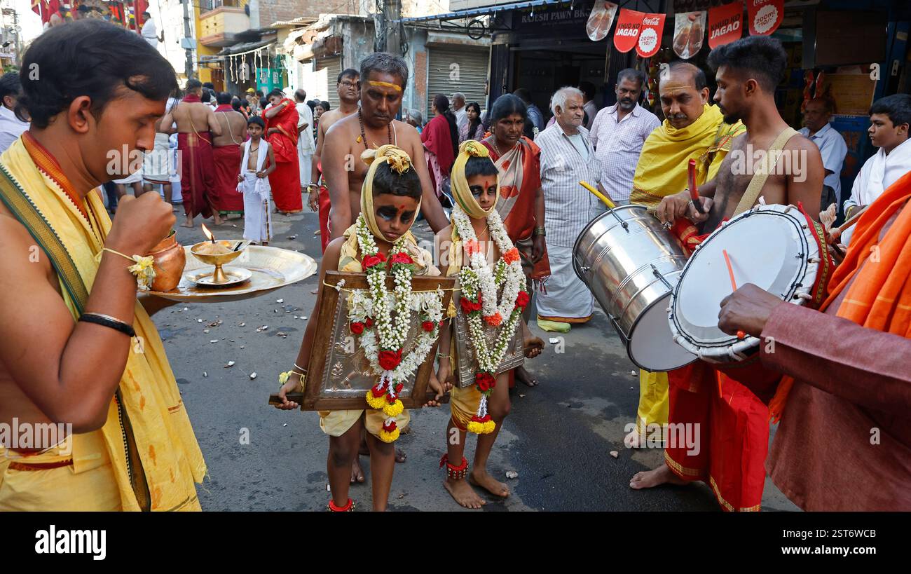 Two boys from the Devanga (weaver's caste) lead a procession to ...
