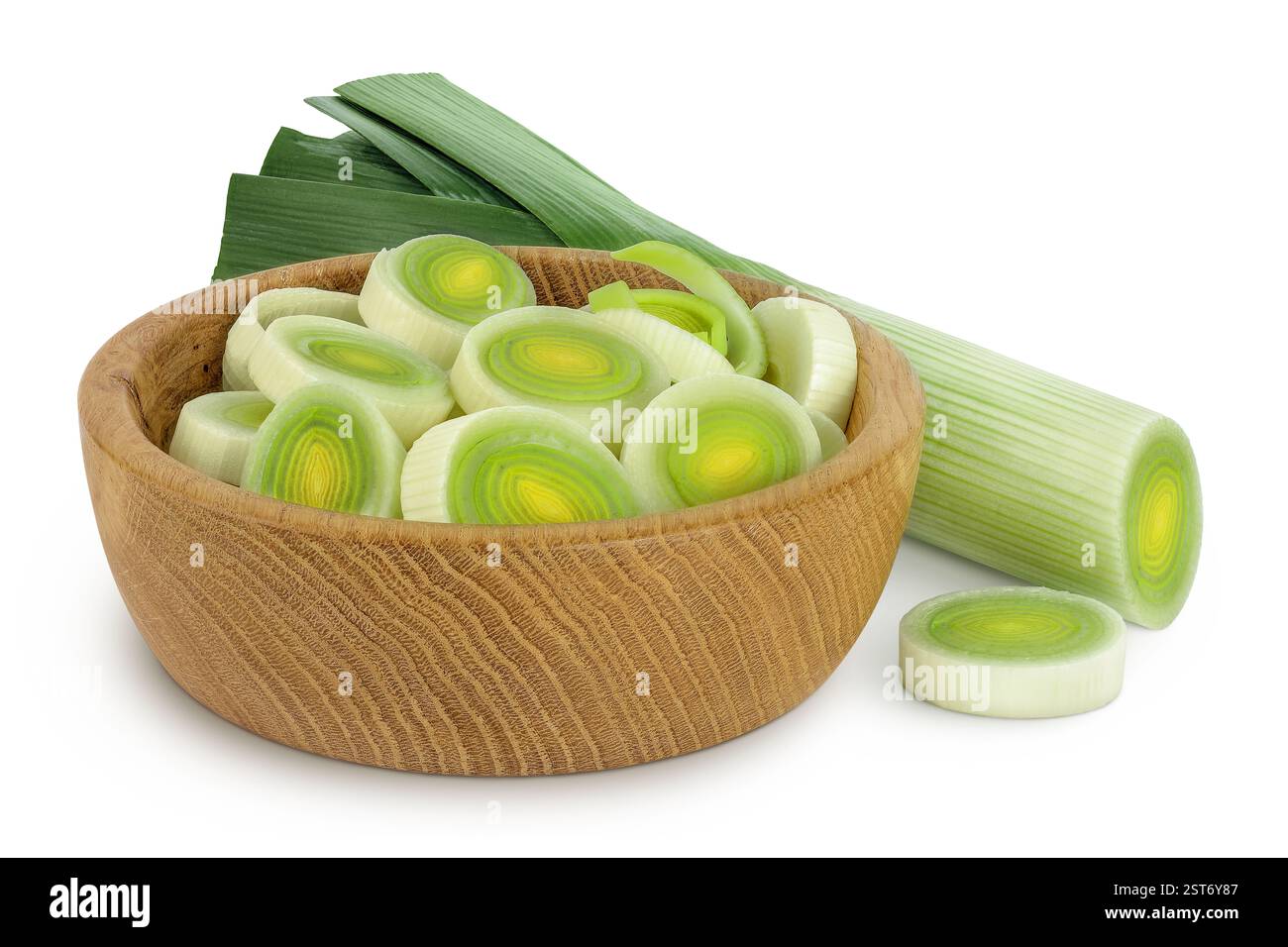 sliced Leek vegetable in wooden bowl isolated on white background with ...