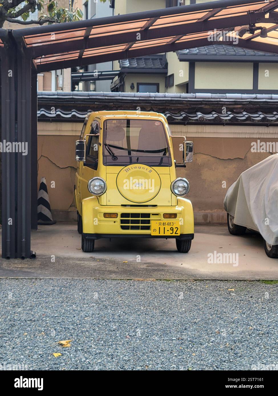 Charming Vintage Yellow Micro Car Beautifully Set Against a Scenic ...