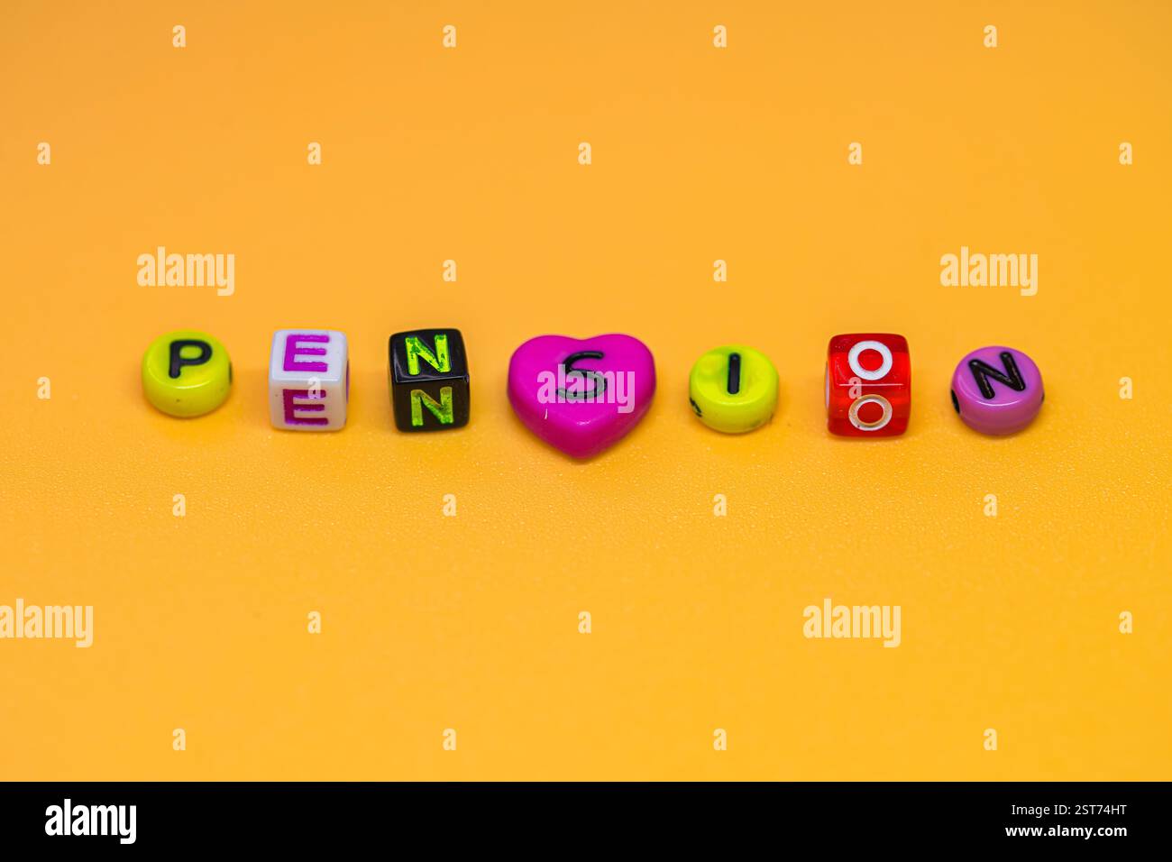 Vibrant arrangement of alphabet beads forming the word 'Pension ...