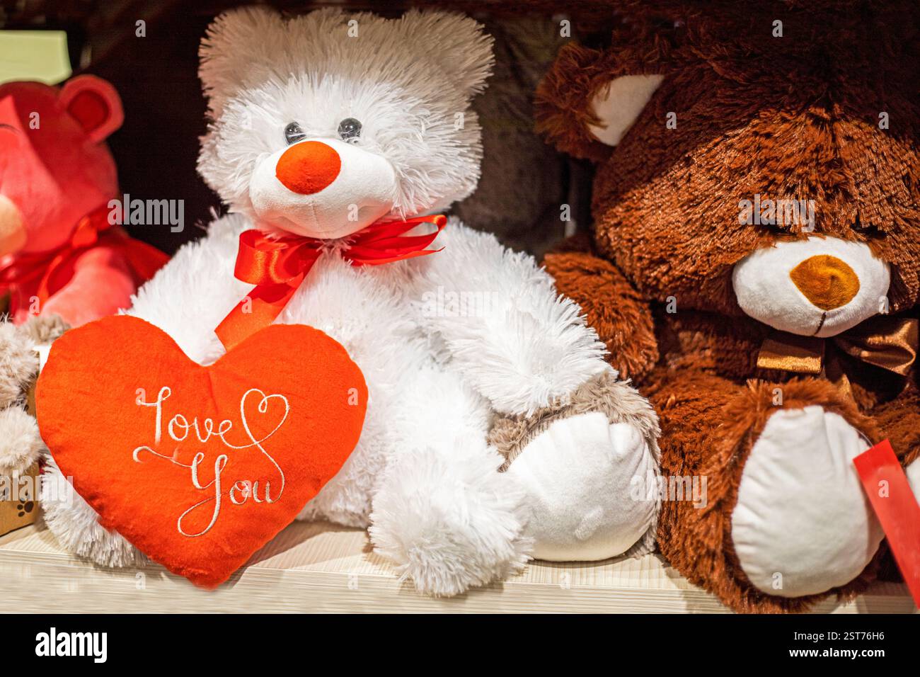 soft toy teddy bears with a red heart in their paws and the inscription ...