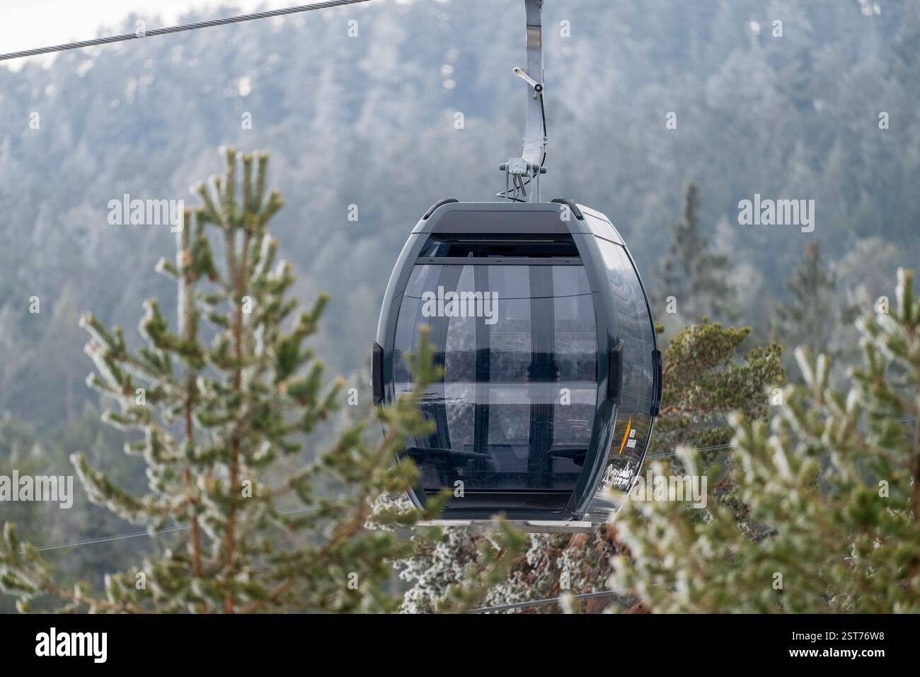 View of a gondola moving toward the U-Alm middle station of the Imst ...