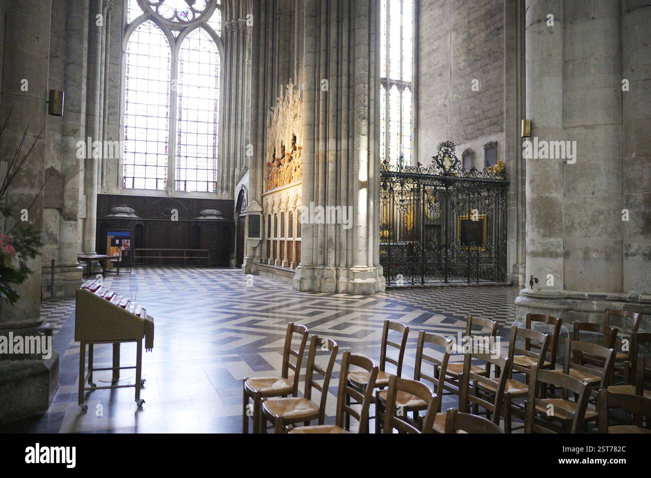 A serene side chapel in Cathedral, featuring tall stained glass windows ...