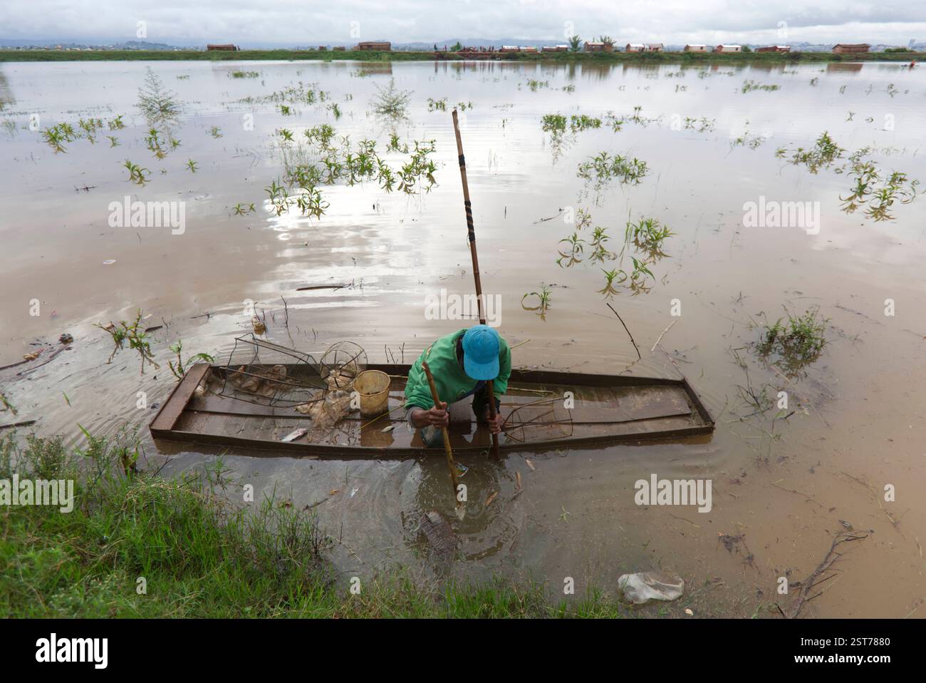 Floods in Antananarivo, Madagascar A village fisherman retrieves his ...