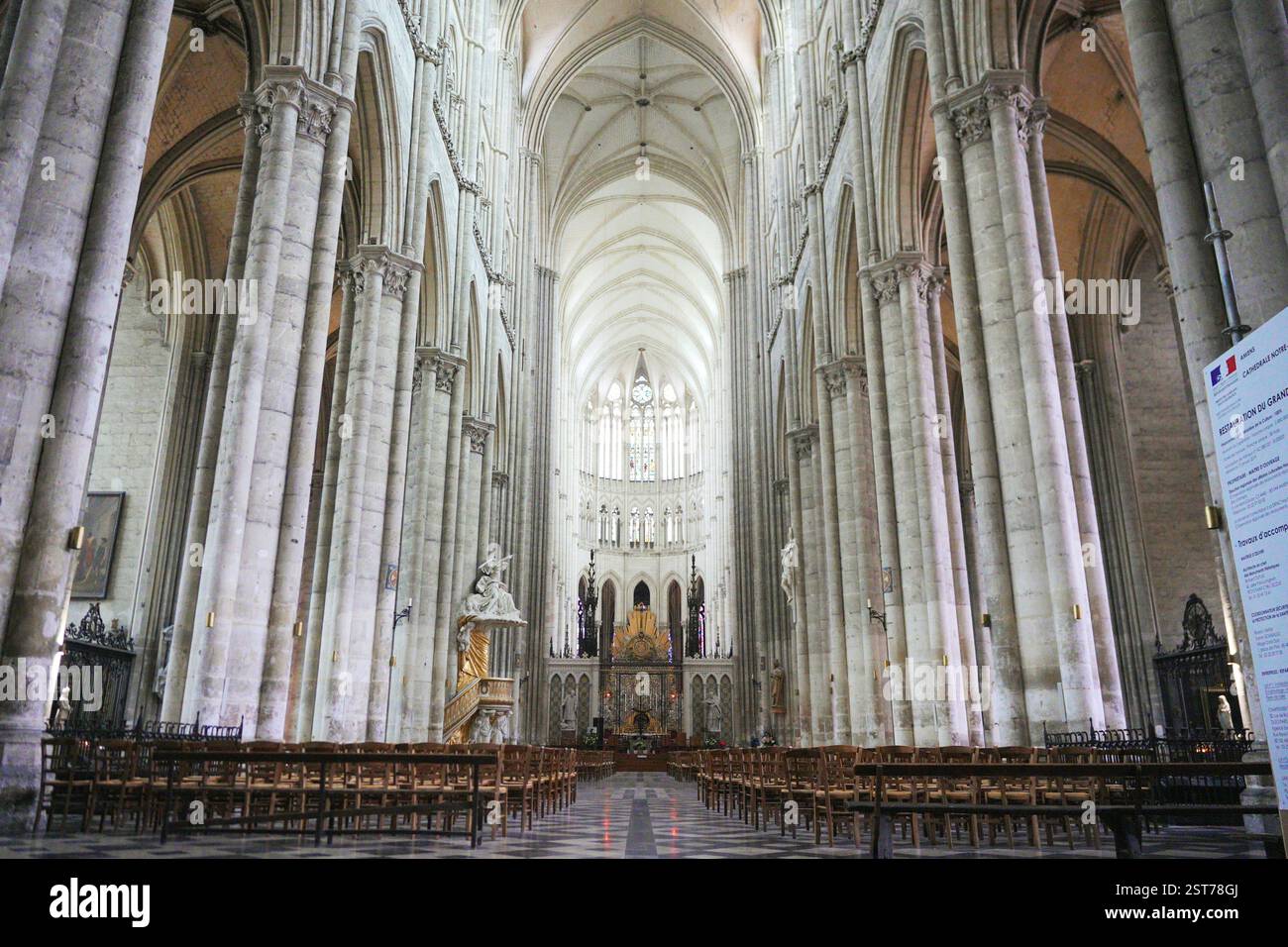 Interior view of Cathedral in France, featuring towering Gothic columns ...
