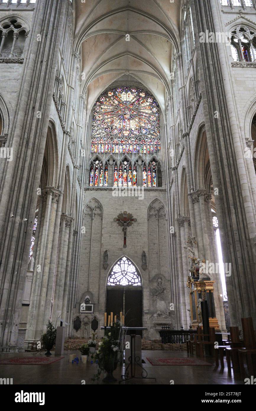 Interior of Cathedral, showcasing a vibrant rose window, Gothic arches ...