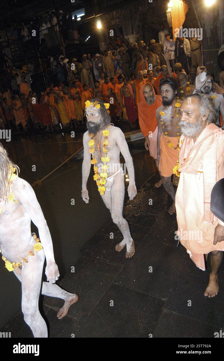 Naga Sadhus arrive to take a holy dip during the Kumbh Mela 2003 at ...