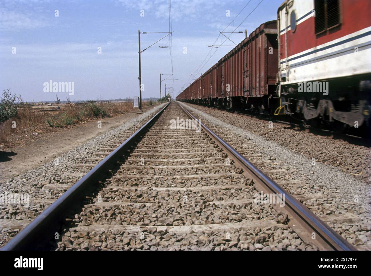 Train passing on railway line, india Stock Photo - Alamy
