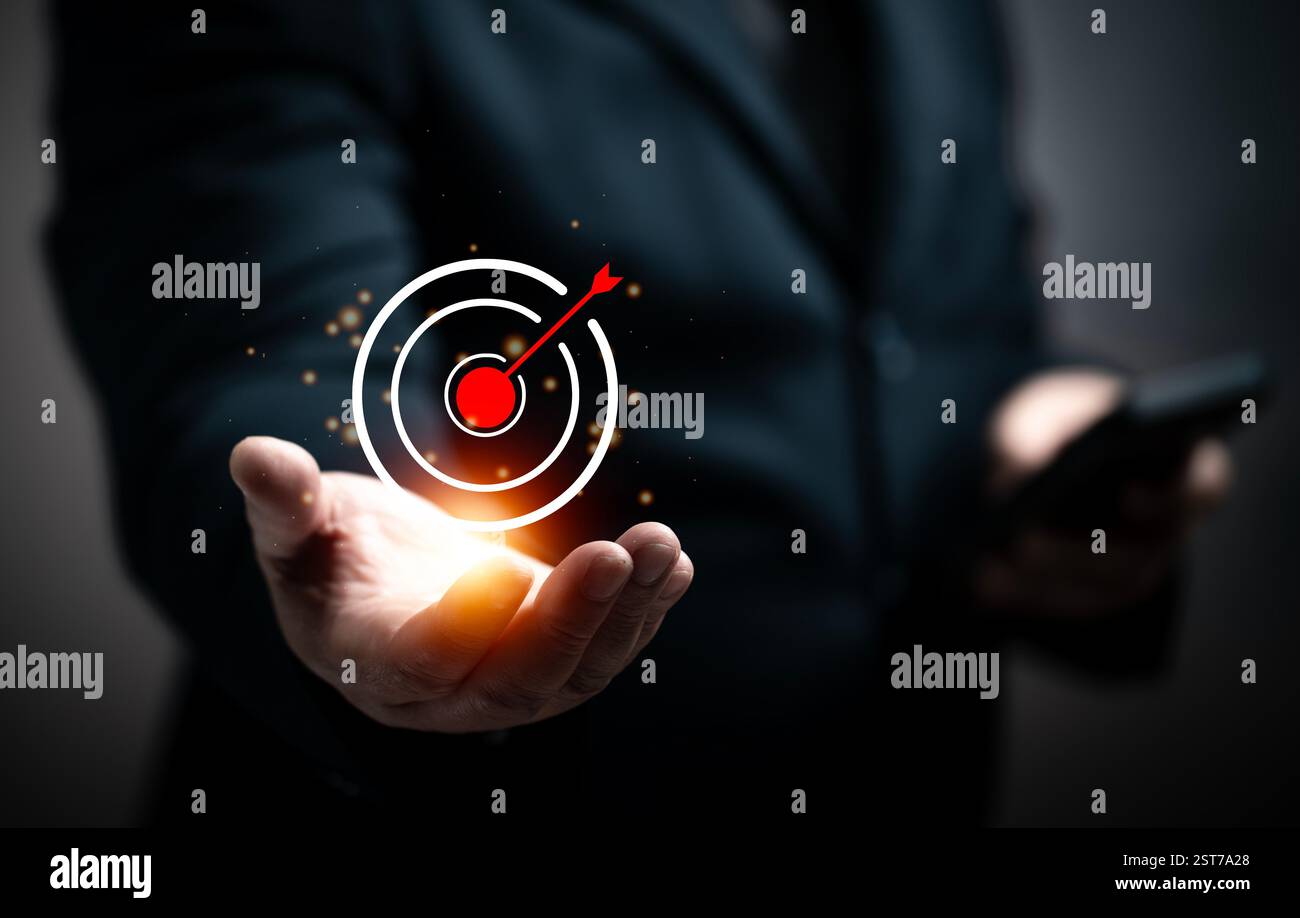 man hold the marketing icon in hand. business target for success ...