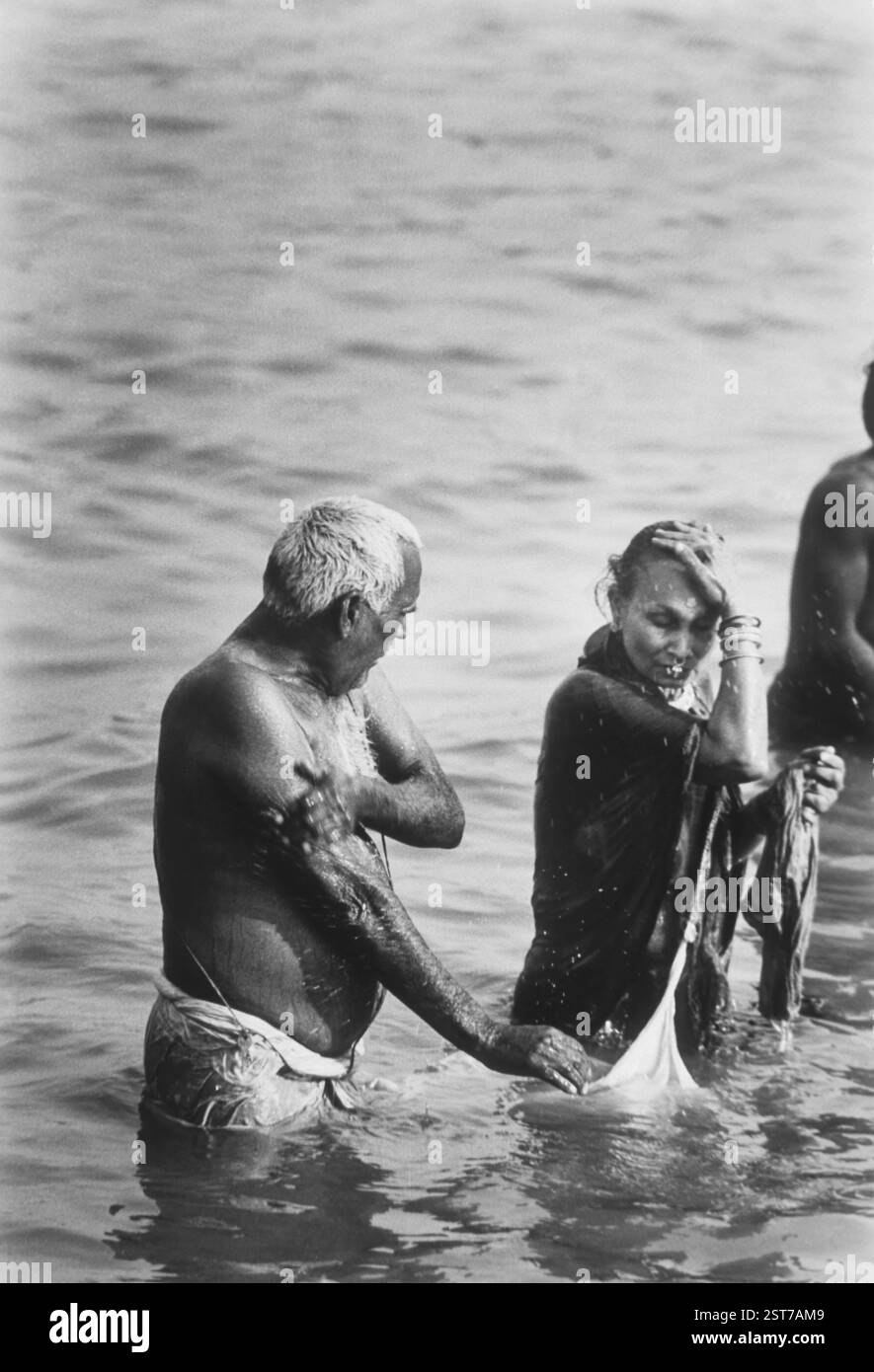 People taking holy dip Stock Photo - Alamy
