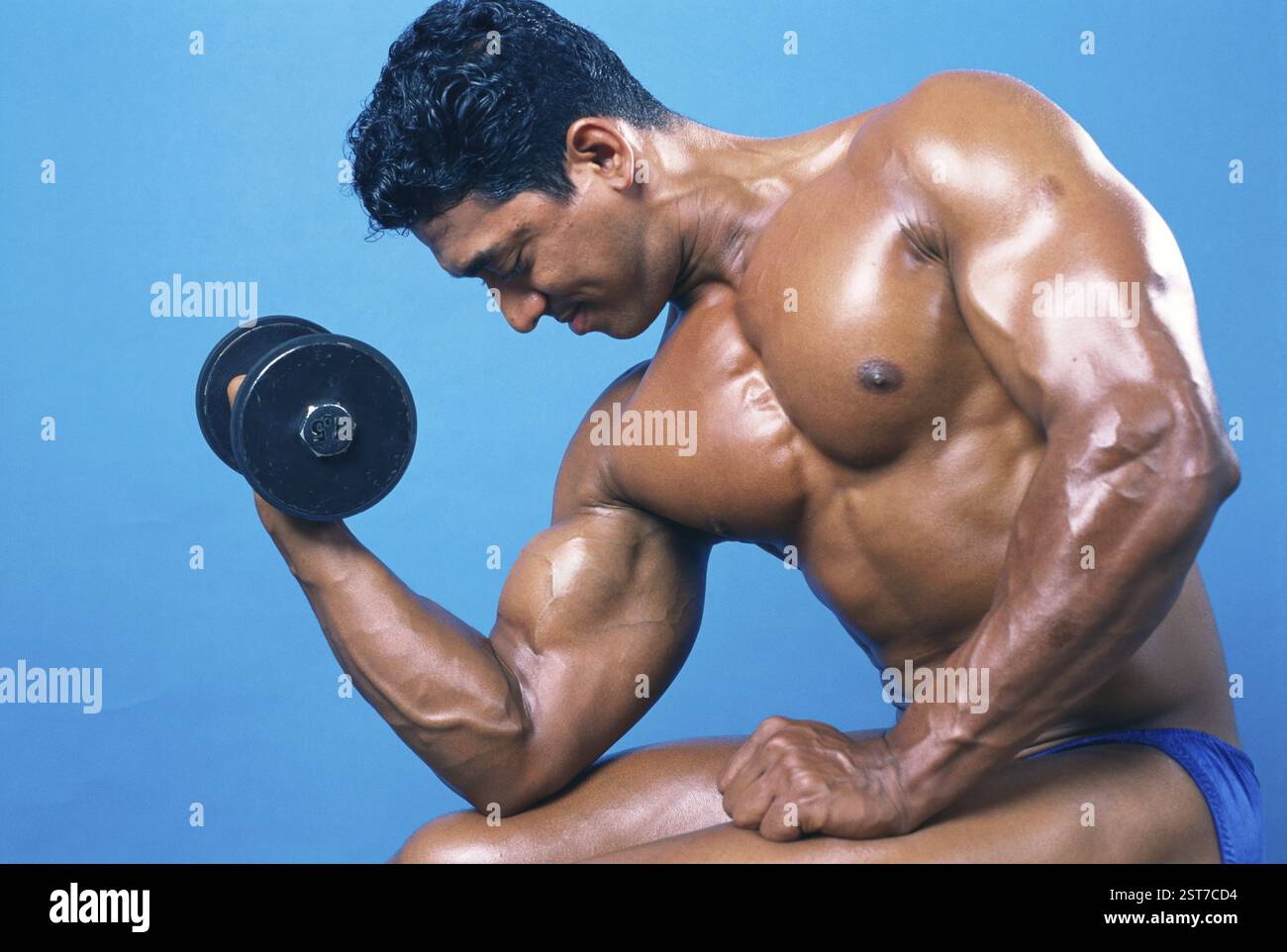 Body builder practicing with dumbbell MR#411 Stock Photo - Alamy