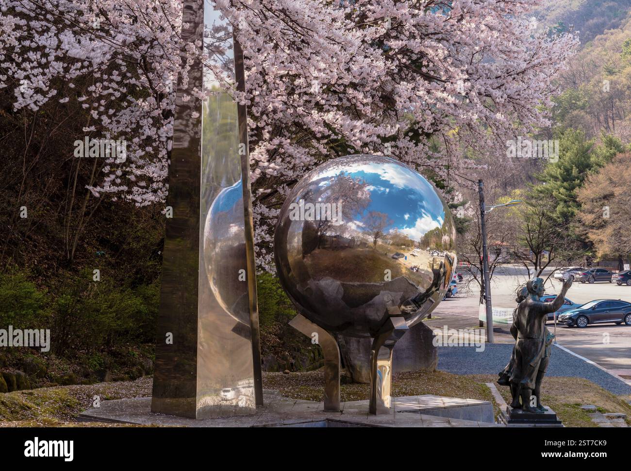 Chungju, South Korea, April 14, 2019: Metal reflective sphere and spire ...