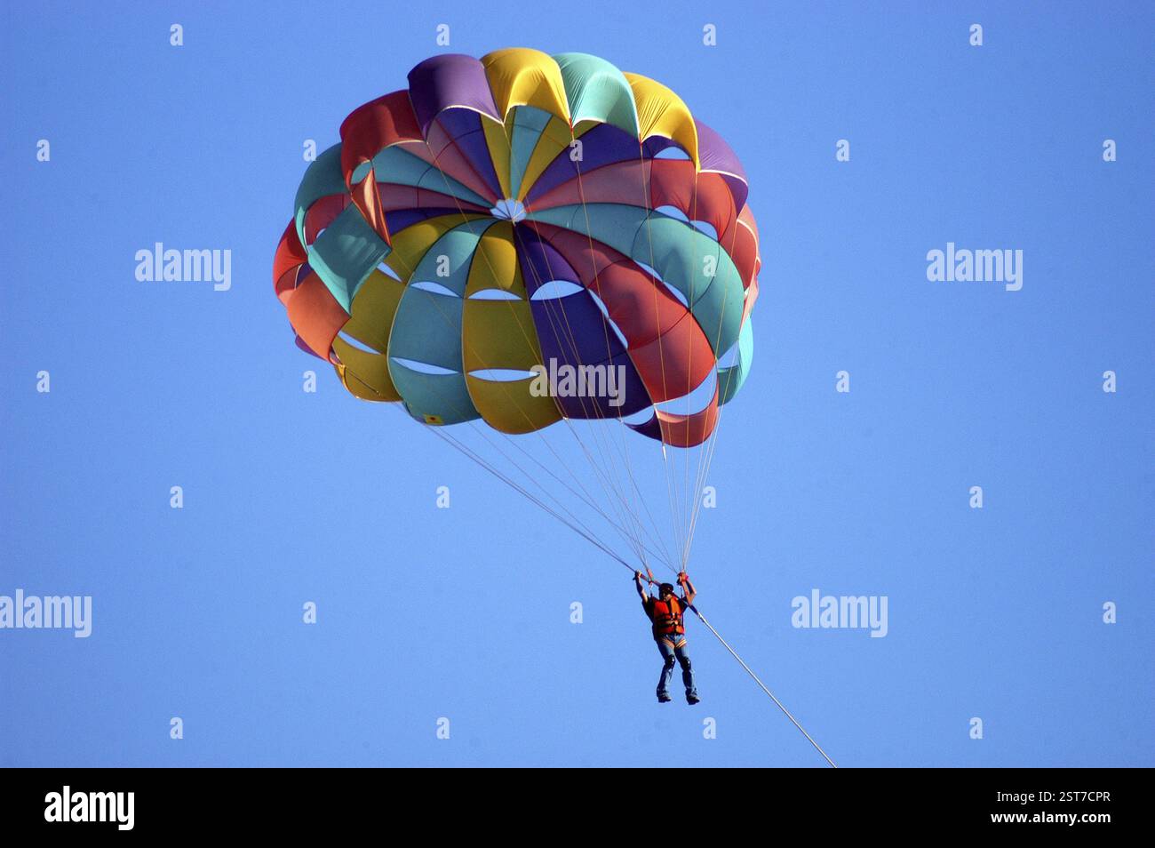 Parasailing one man with colourful parachute on Chowpatty, Marine Drive ...