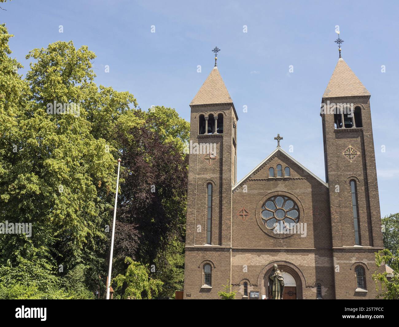 Church with two bell towers and round window in sunny daylight, ulft ...