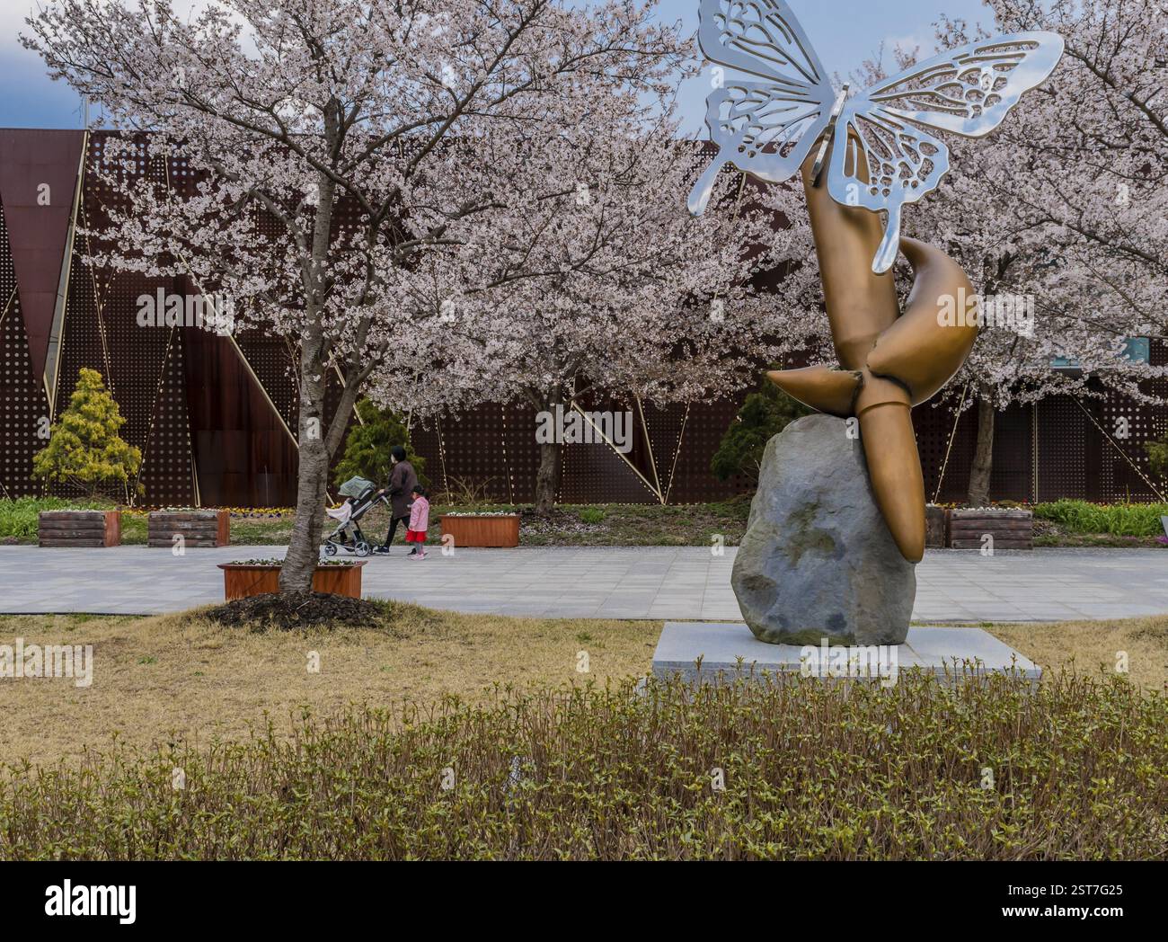 Hwanggan, South Korea, April 10, 2020: Woman pushing stroller with ...