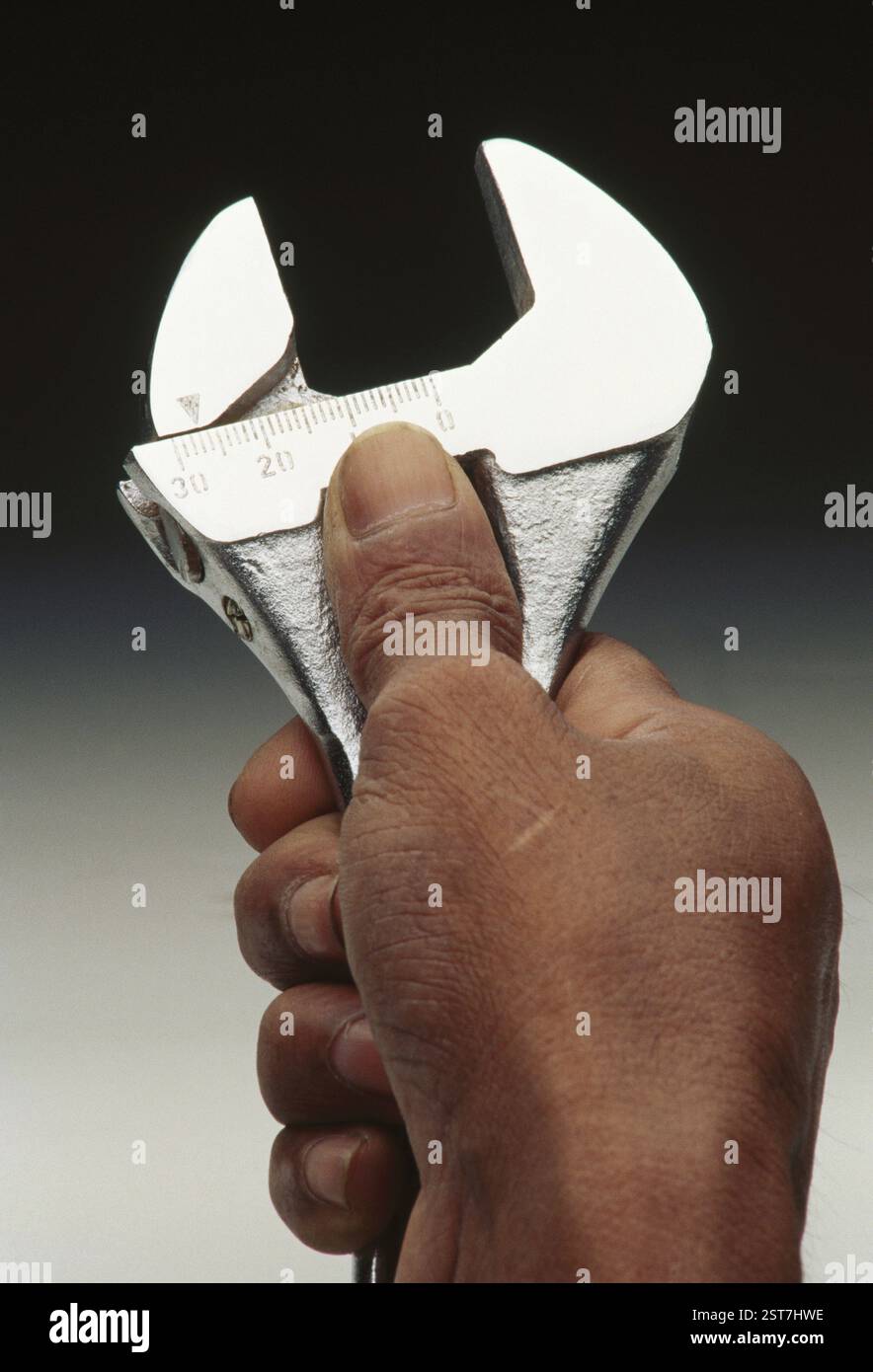 Adjustable spanner in hand, india Stock Photo - Alamy
