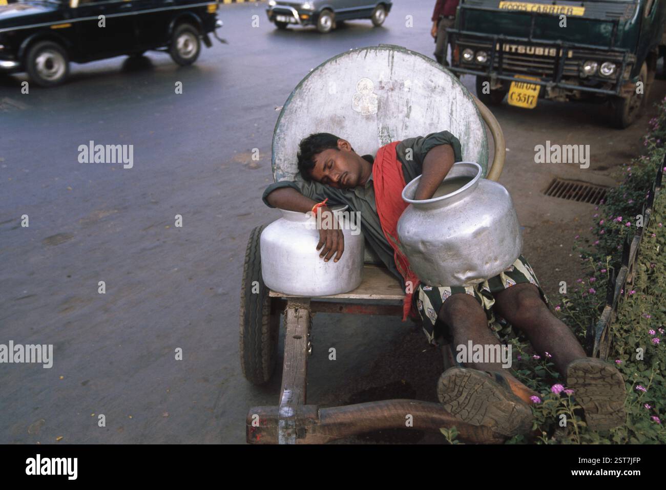 Siesta time, man sleeping on his cart Stock Photo - Alamy