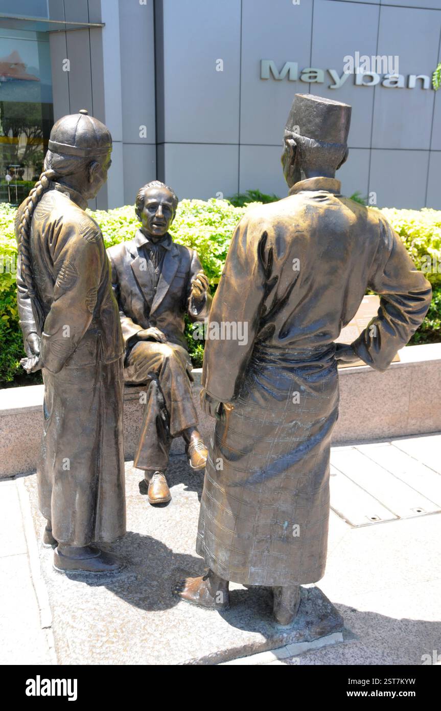 At the 32-storey Maybank Tower are some statues called ‘River Merchants ...