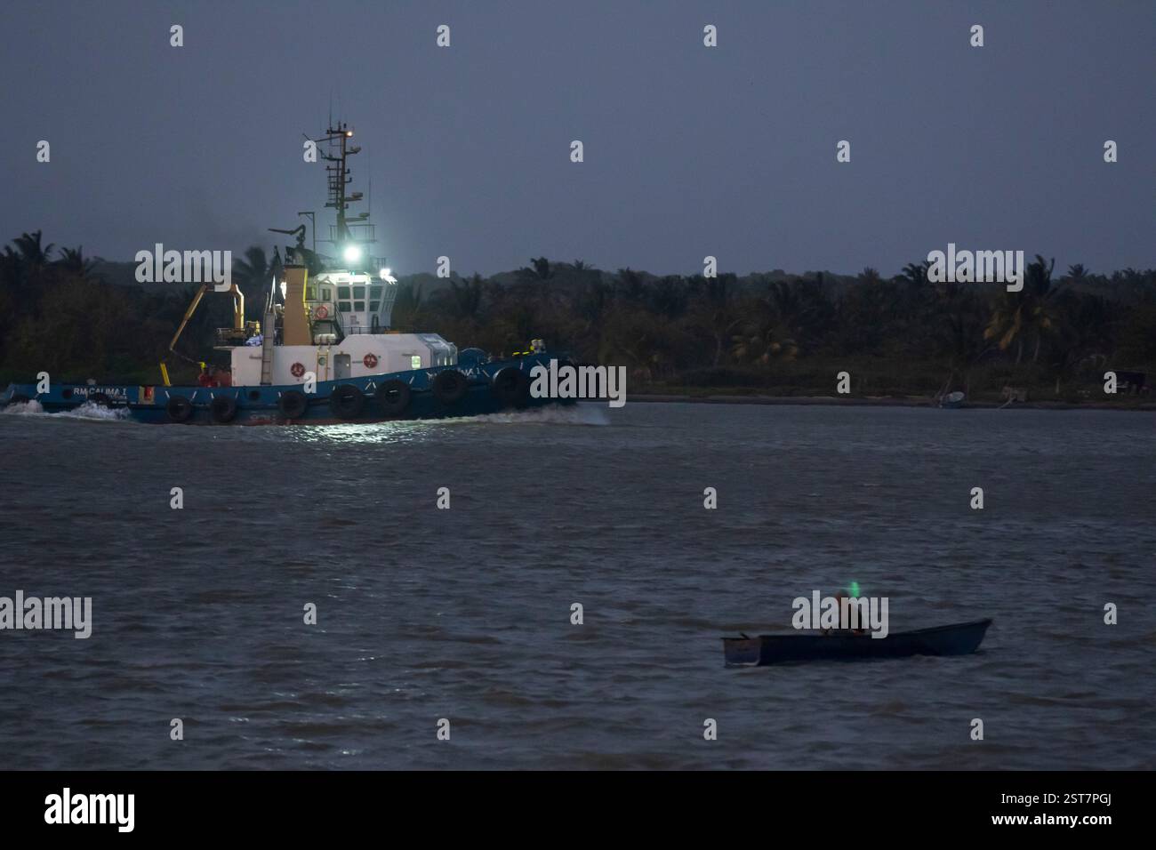 Boats on the Magdalena River: abandoned vessel, tugboat, tourist ferry ...