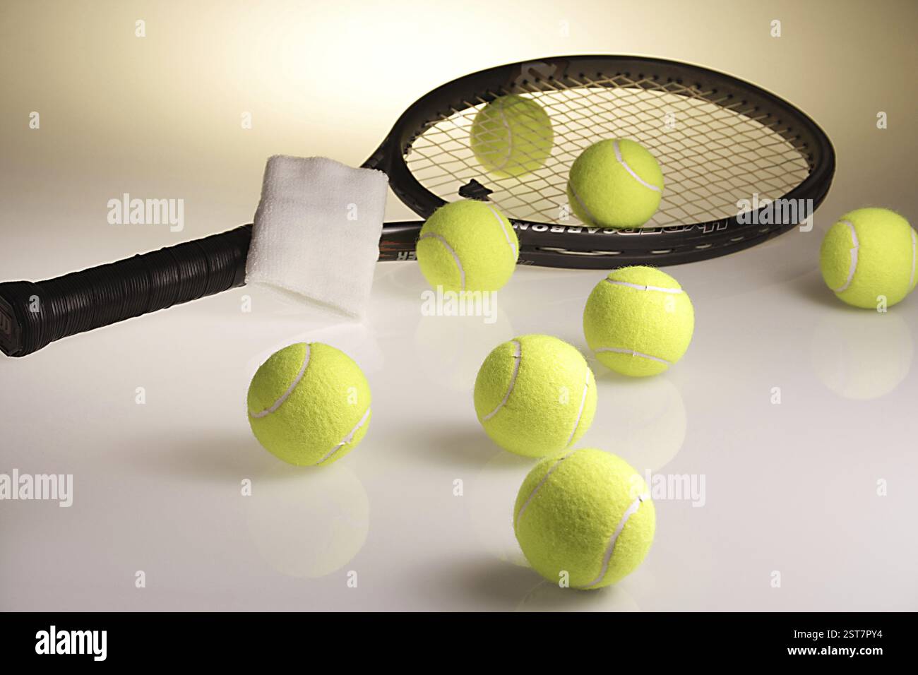 Tennis balls eight green color with tennis racket and wrist band Stock ...