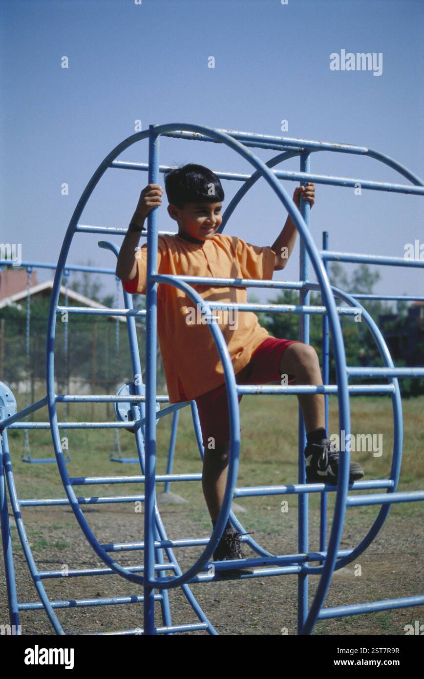 South Asian Indian boy playing with jungle gym MR#158 Stock Photo - Alamy