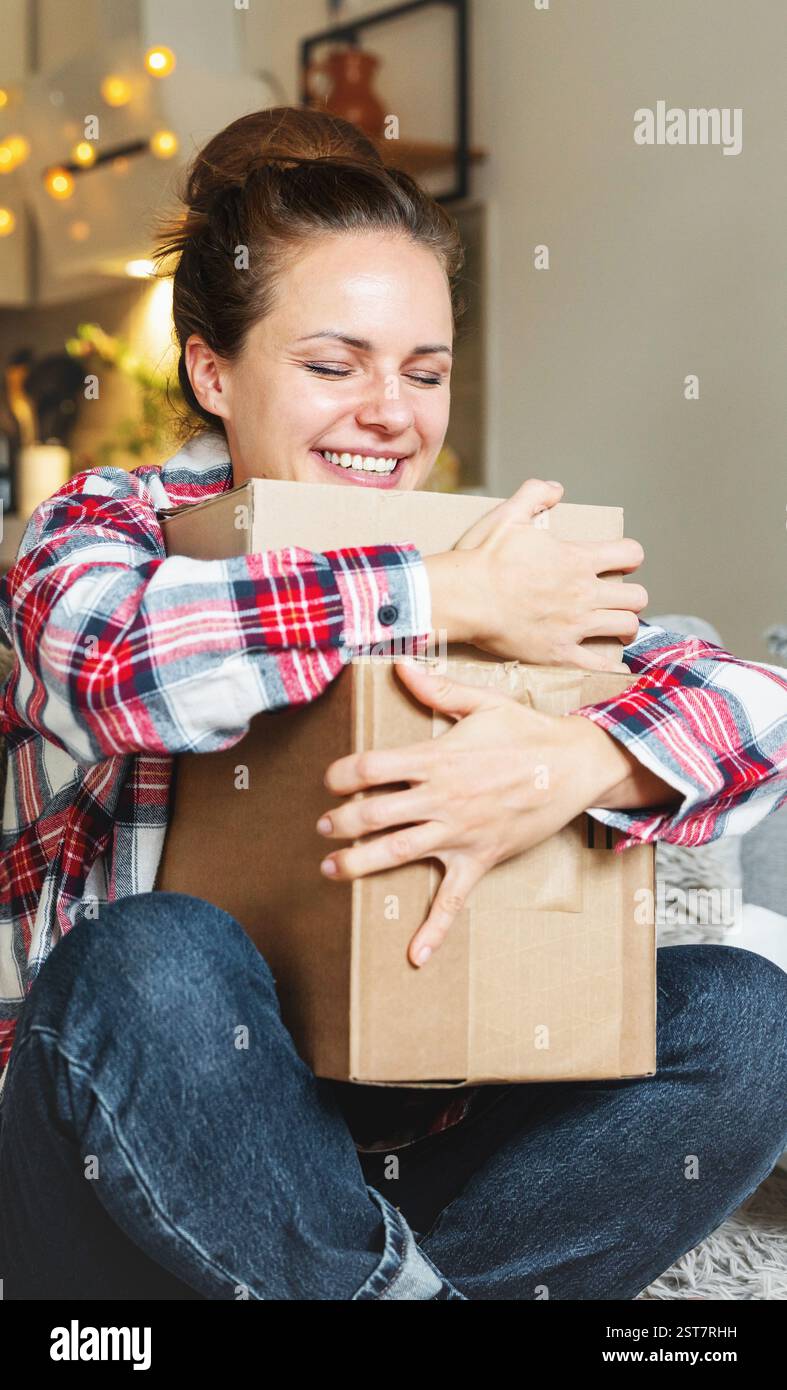 Happy woman hugging cardboard boxes celebrating online shopping ...