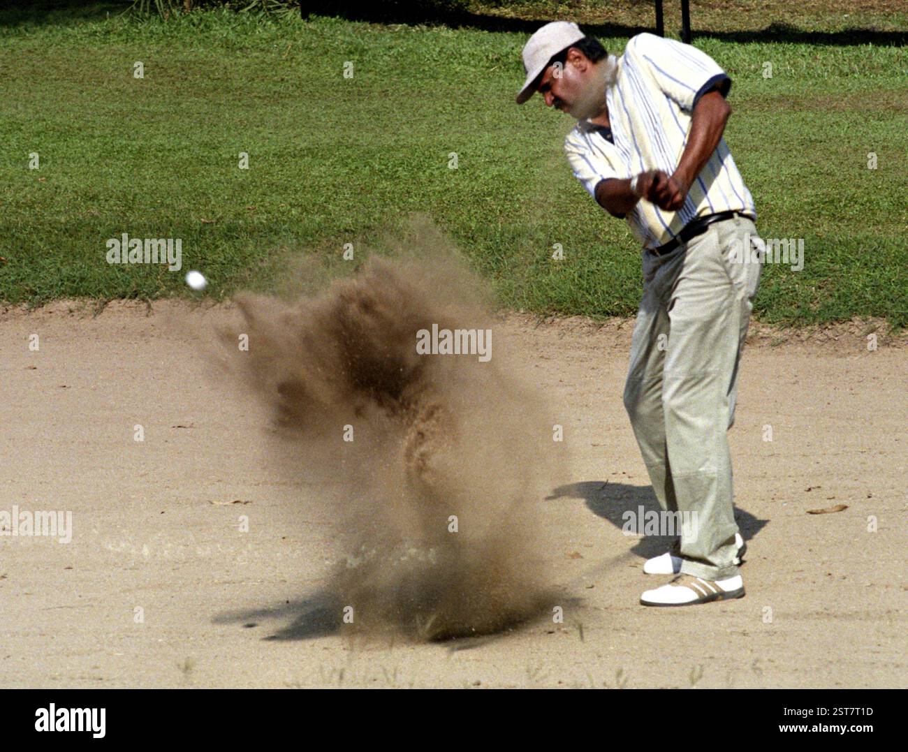 Indian sport great cricket captain Kapil Dev plays a game of golf at ...