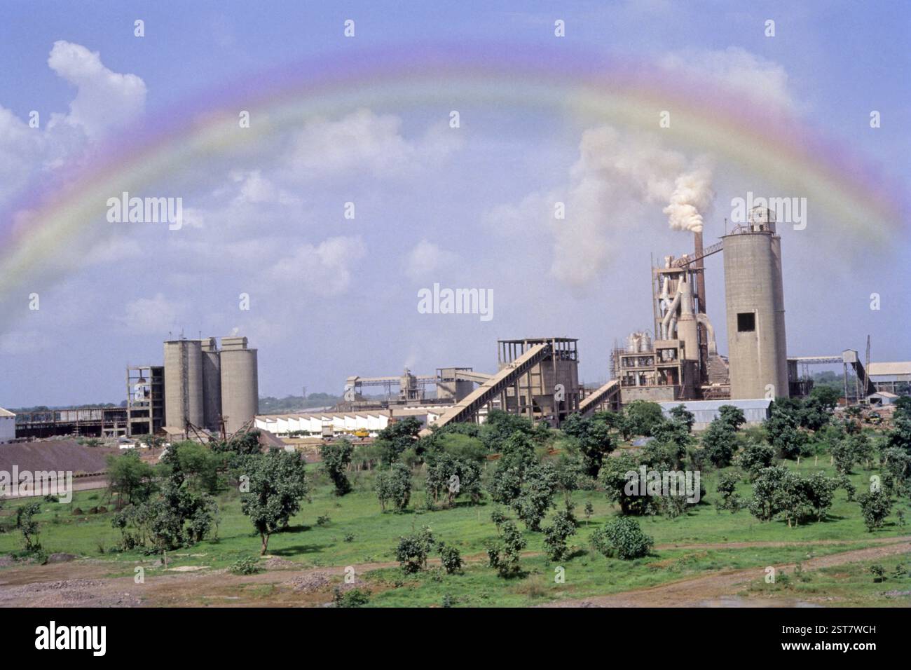 Cement factory and rainbow, india Stock Photo - Alamy