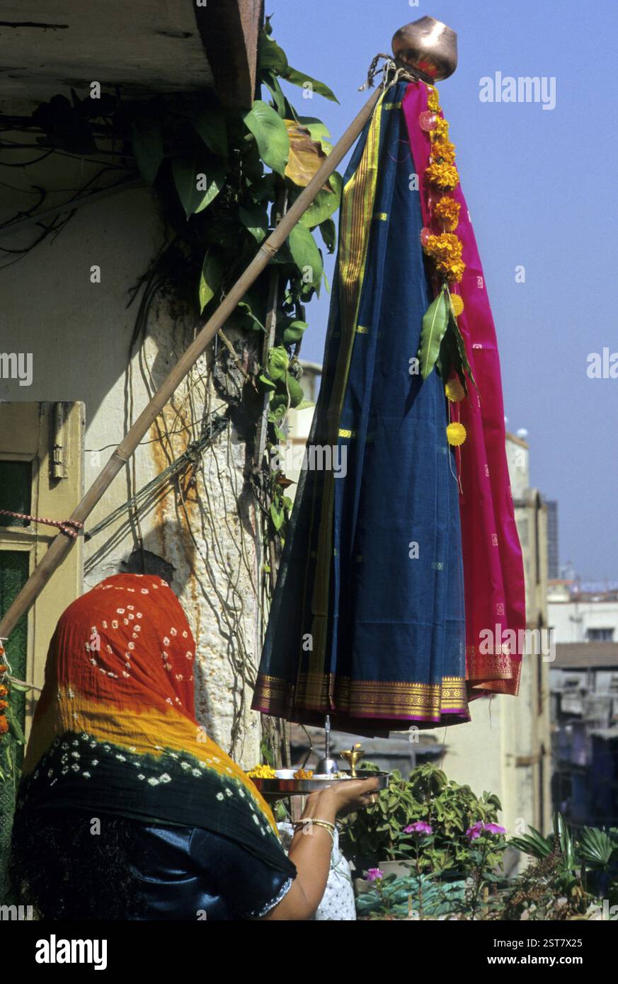 Woman doing pooja of Gudi on Gudi Padva festival, bombay mumbai ...