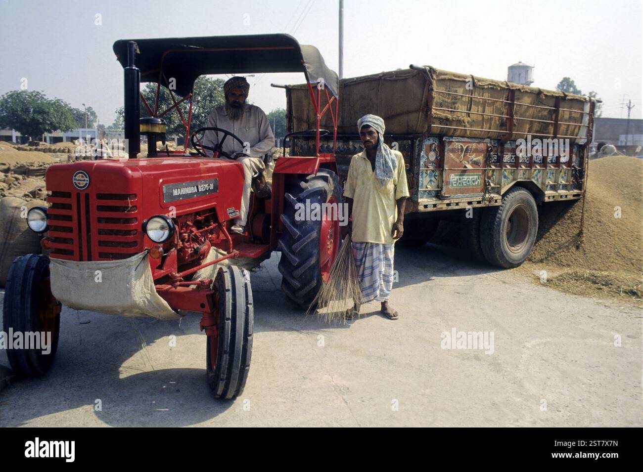 Farmer with his tractor trolley in a grain mandi, punjab, india Stock ...