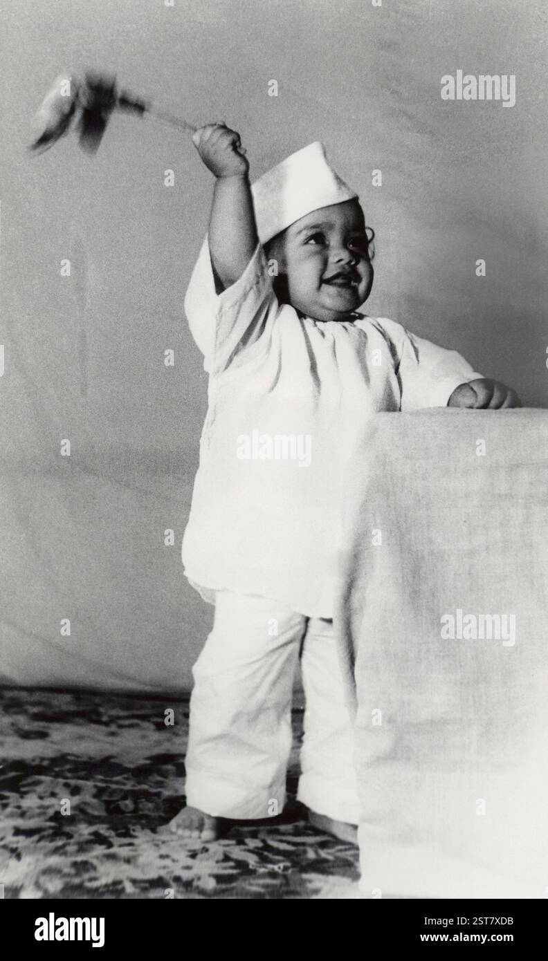 Dressed up in khaddar kurta and Gandhi cap, a child waves the Indian ...