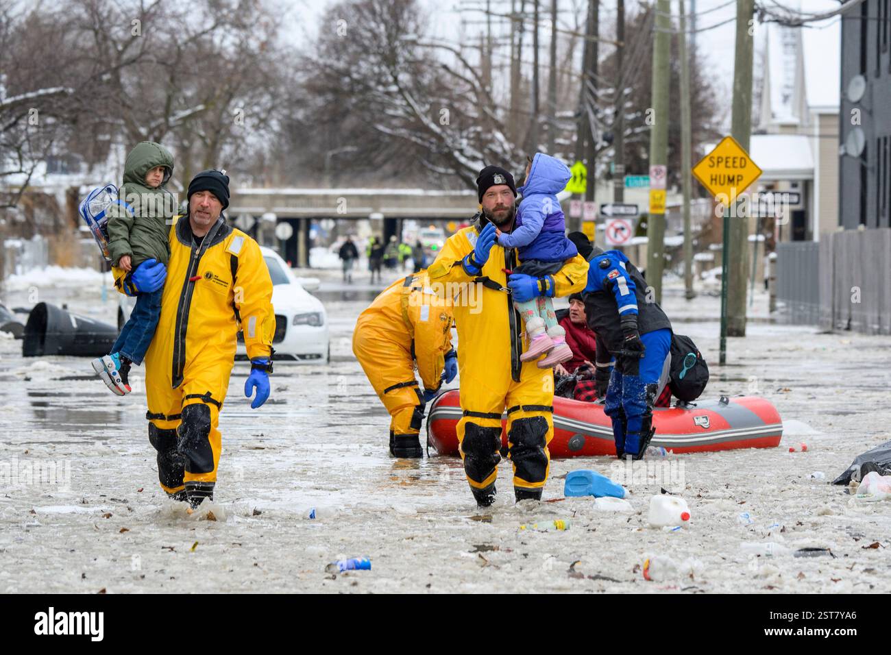 Members of the Downriver Dive Team carry children to safety after a ...