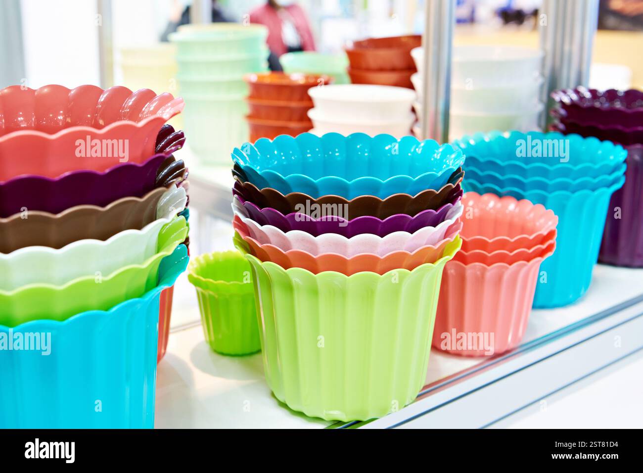 Colored plastic plant pots in store Stock Photo - Alamy