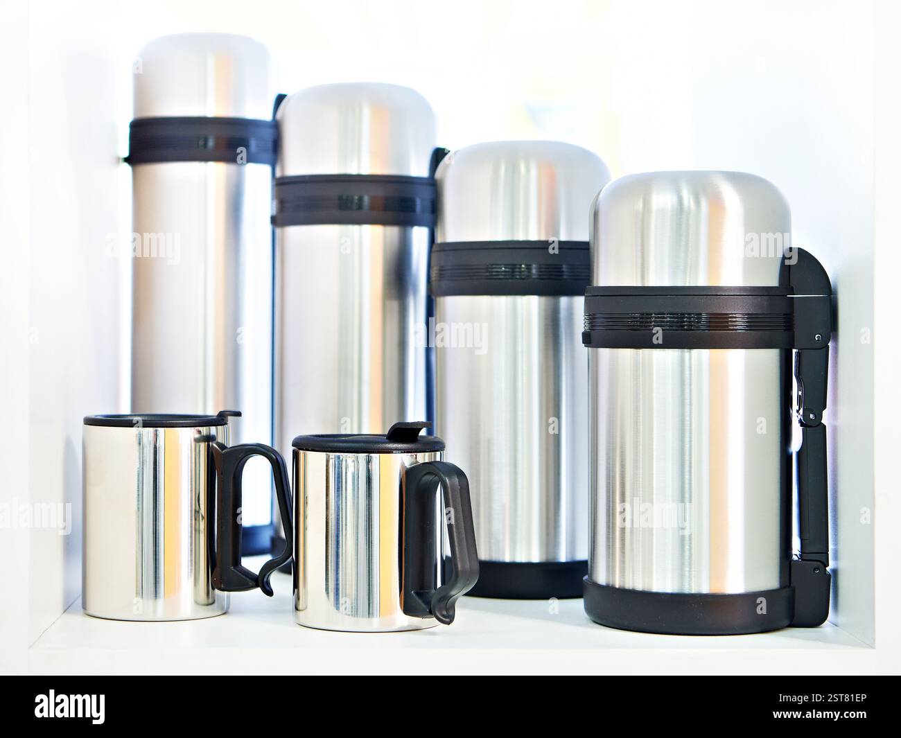 Thermos and mugs metal stainless steel in the store Stock Photo - Alamy