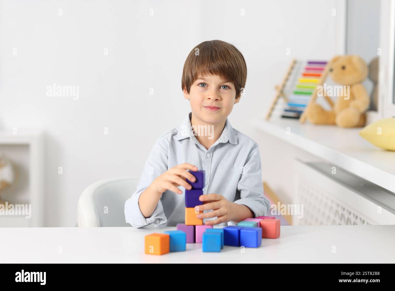 Boy building tower colorful hi-res stock photography and images - Alamy