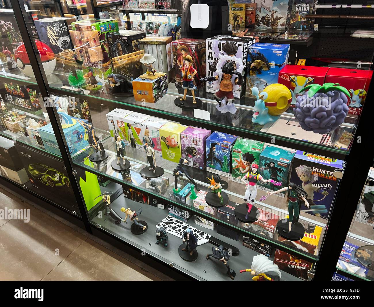 Lviv, Ukraine - February 16, 2025: A glass cabinet containing various ...