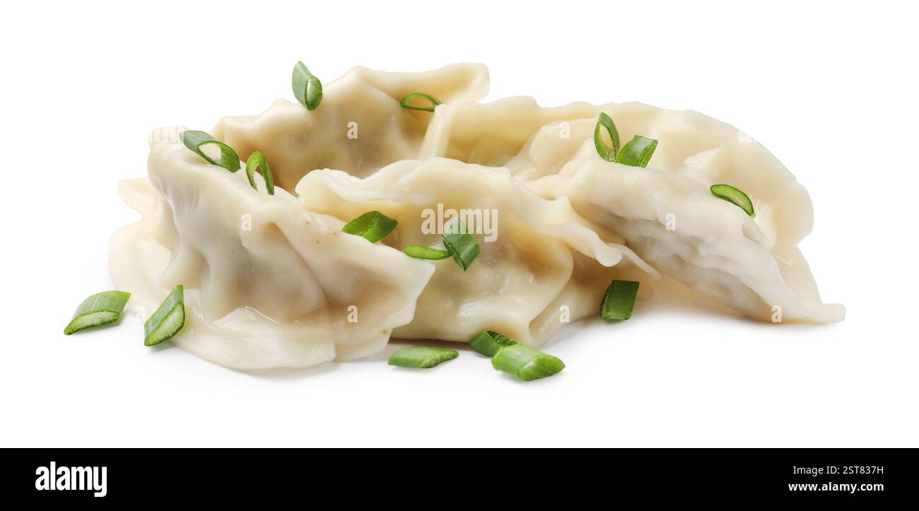 Fresh gyoza dumplings with pieces of green onion isolated on white ...
