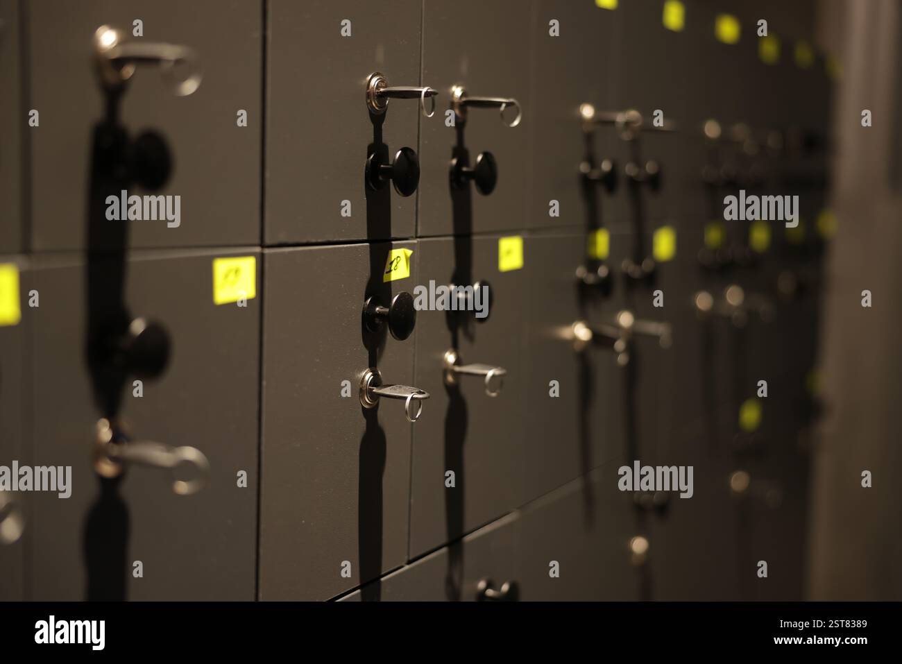 Lockers with keys in gym changing room, closeup Stock Photo - Alamy