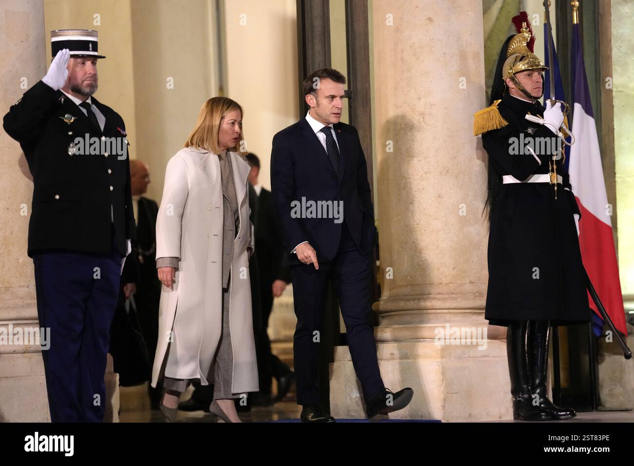 French President Emmanuel Macron, center right, walks with Italy's ...